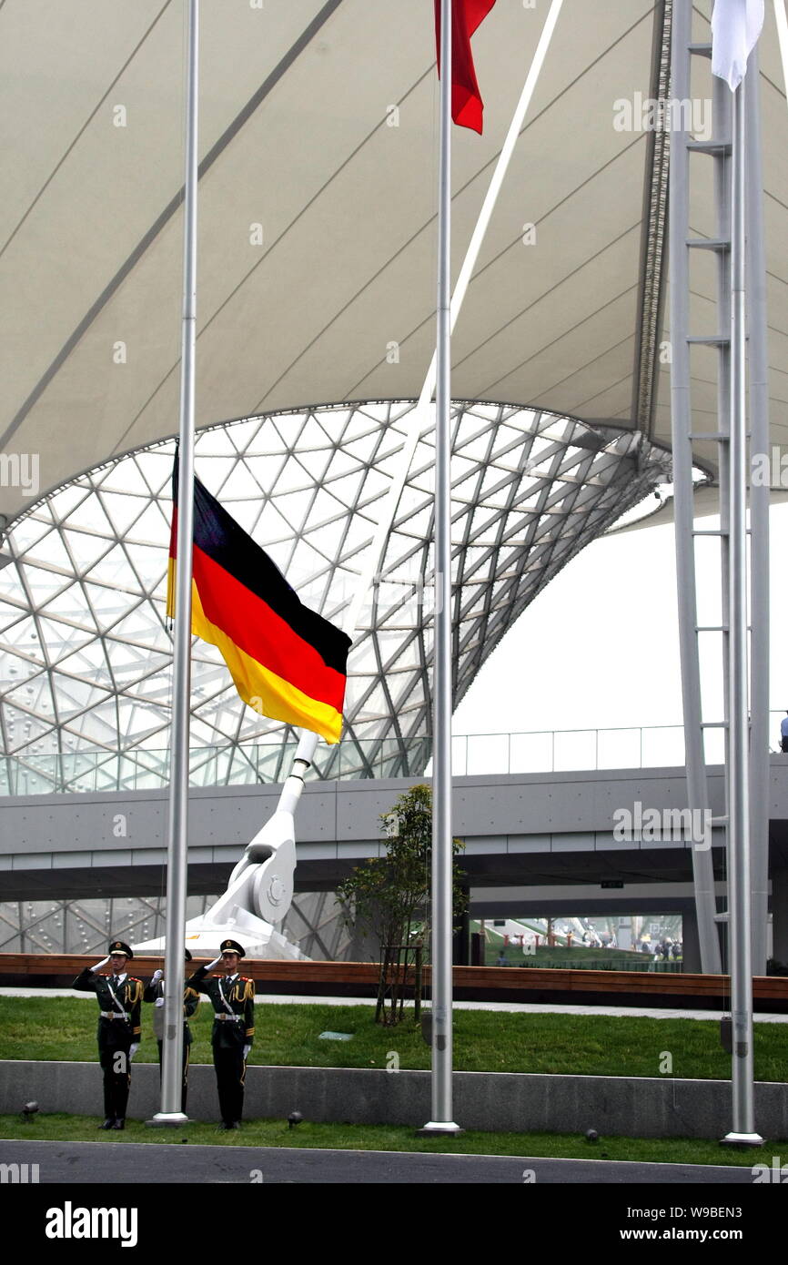 Chinese soldiers raise the German national flag to celebrate the ...