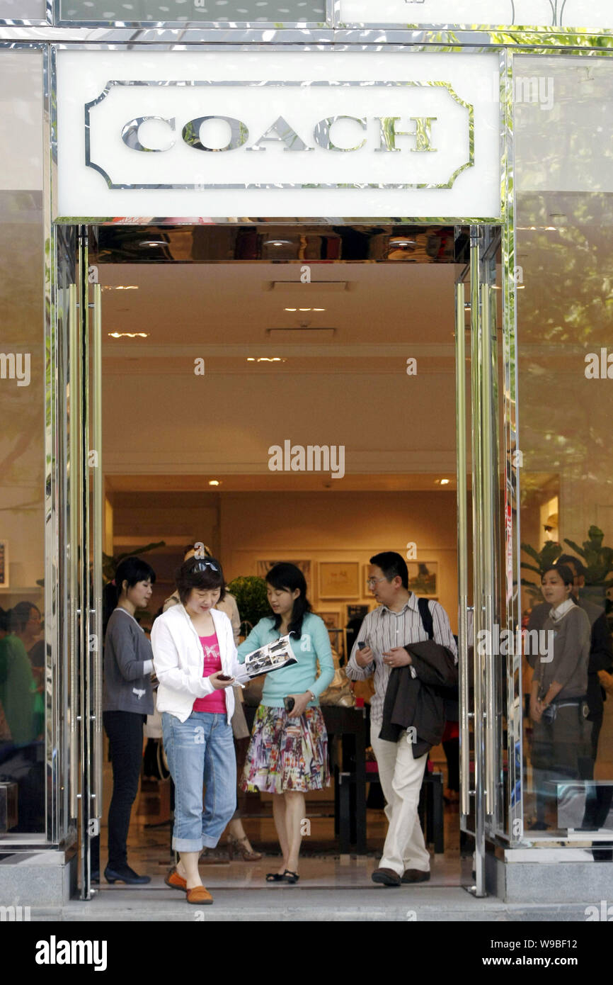 --FILE--Customers walk out of the COACH boutique at the Hong Kong Plaza ...