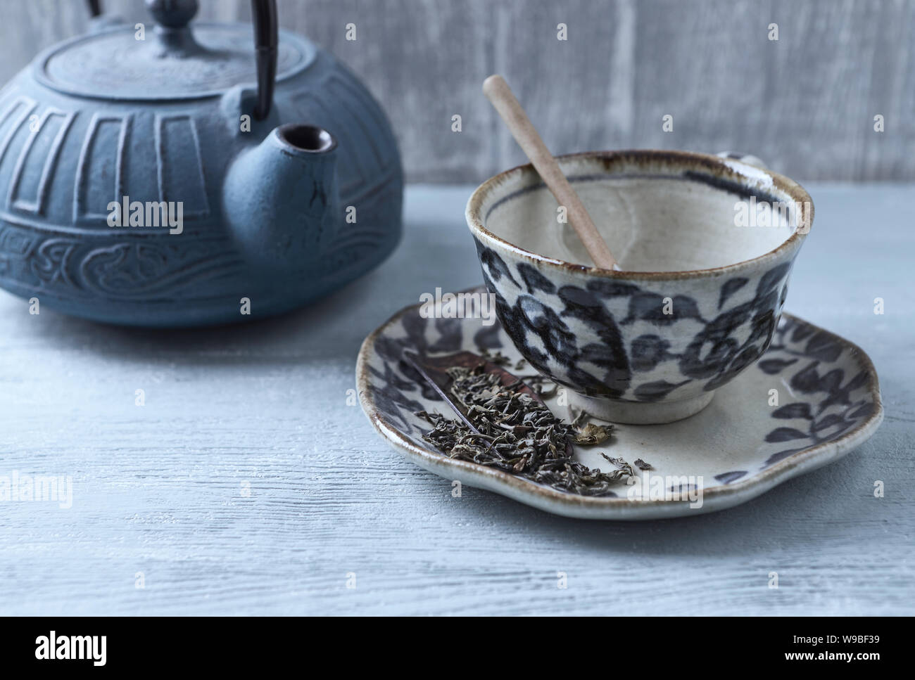 Empty Ceramic Tea Cup and Green Tea Leaves. Symbolic image. Asian ...