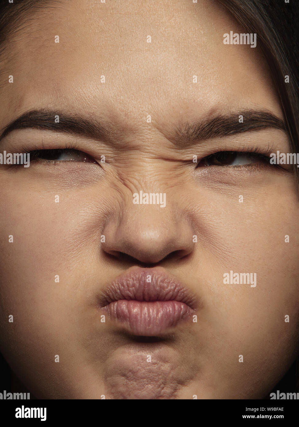 Close up portrait of young and emotional chinese woman. Highly detail ...