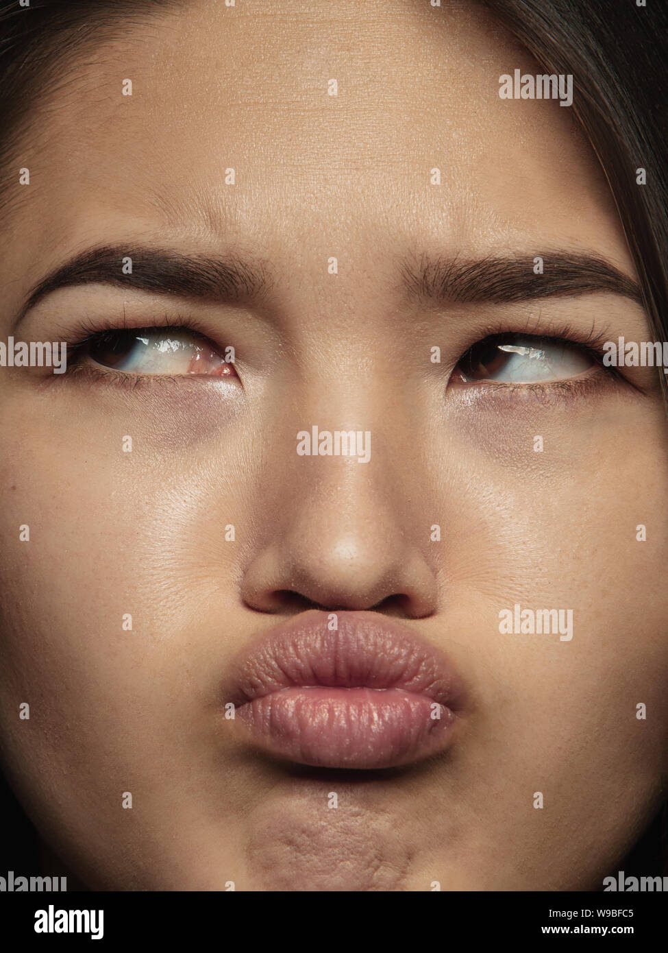 Close up portrait of young and emotional chinese woman. Highly detail ...