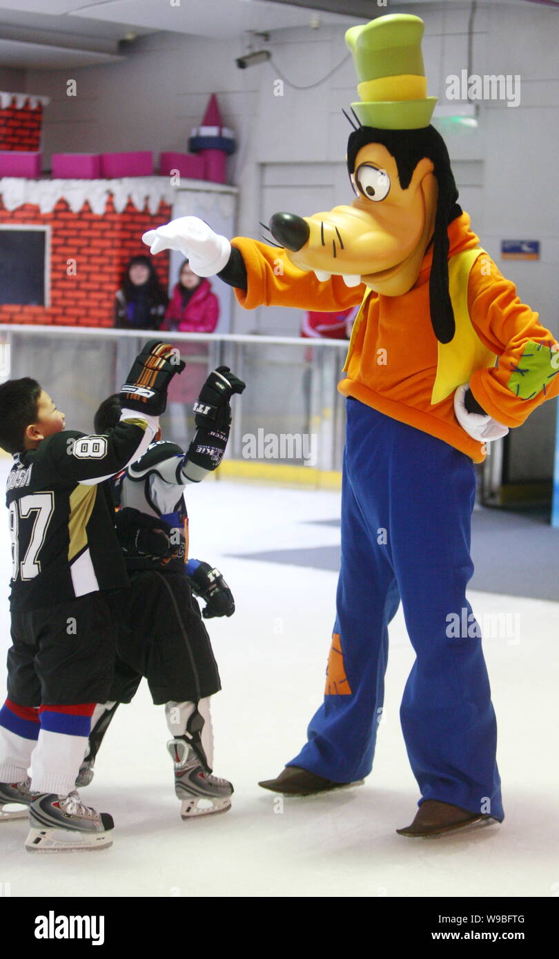 Goofy interacts with kids at a press conference for the ice show ...