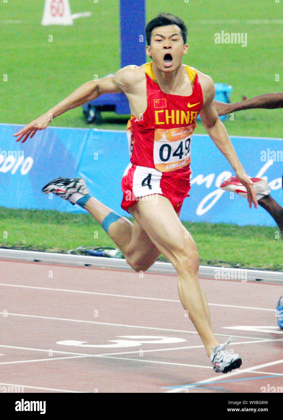 Chinas Lao Yi competes in the mens 100m final in the athletics ...