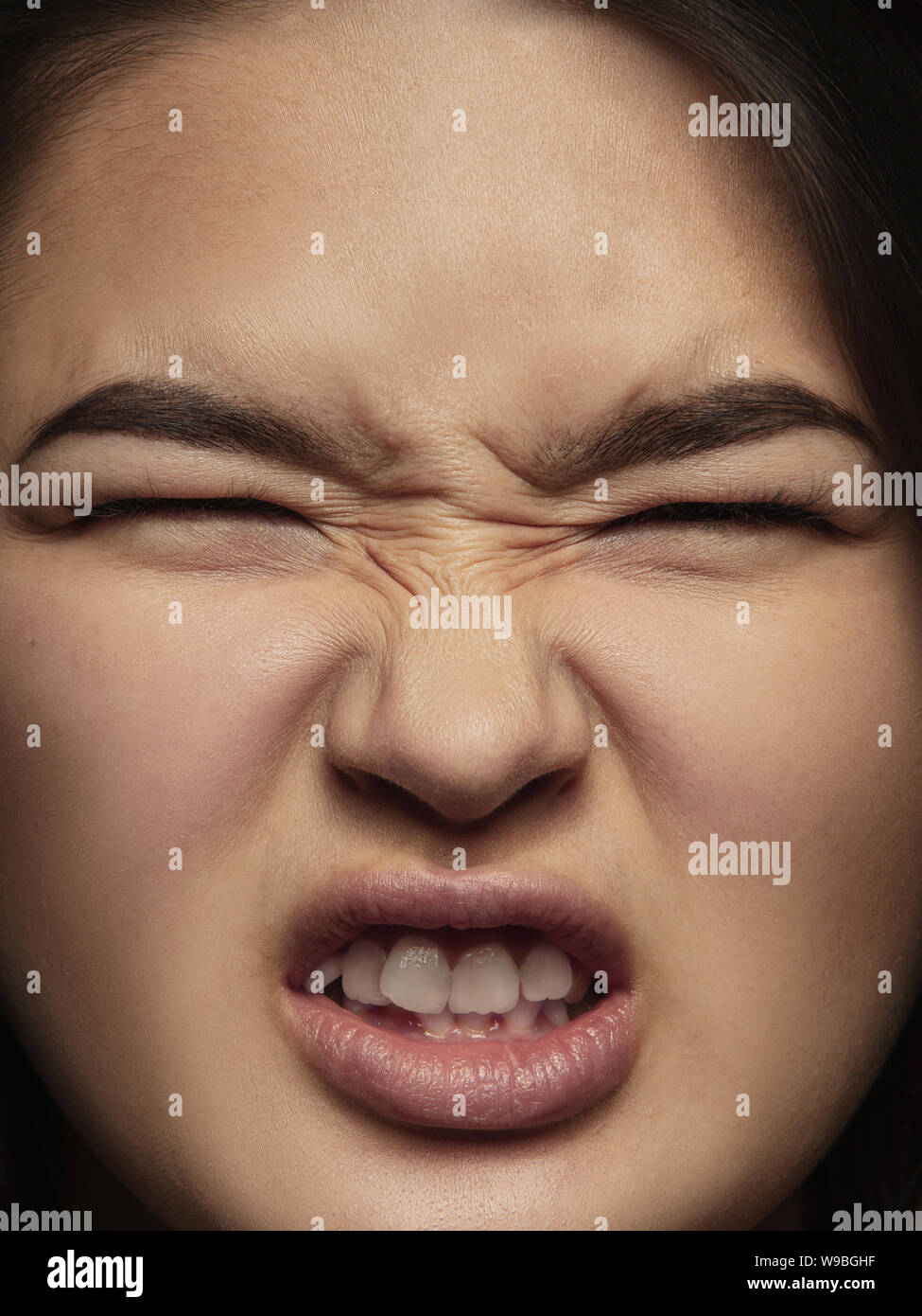 Close up portrait of young and emotional chinese woman. Highly detail ...