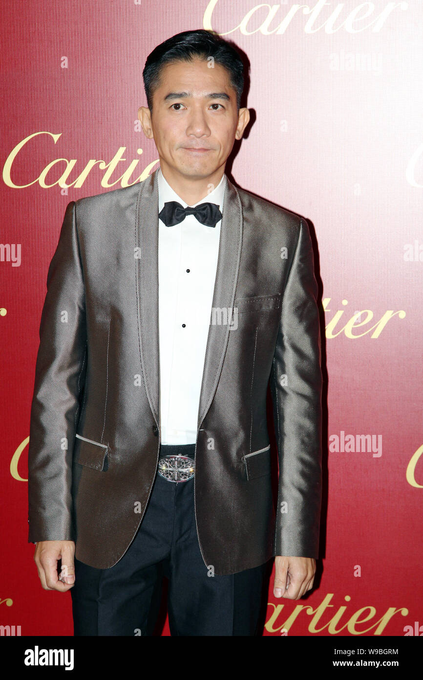 Hong Kong Actor Tony Leung Poses At The Opening Ceremony Of The Cartier Flagship In Hong Kong