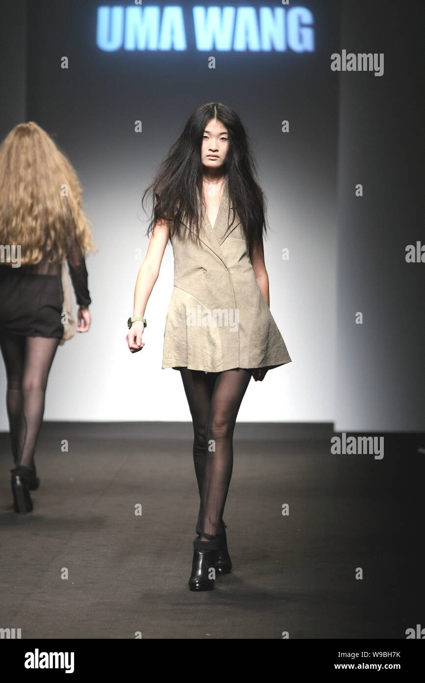 A model parades to show the new collections in the Uma Wang fashion ...