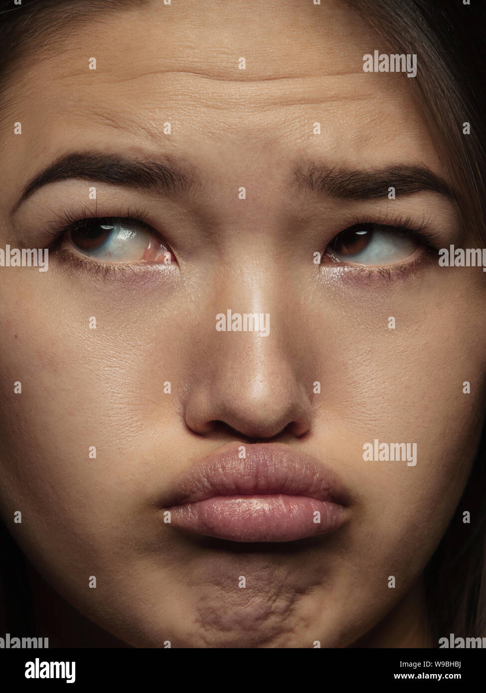 Close up portrait of young and emotional chinese woman. Highly detail ...