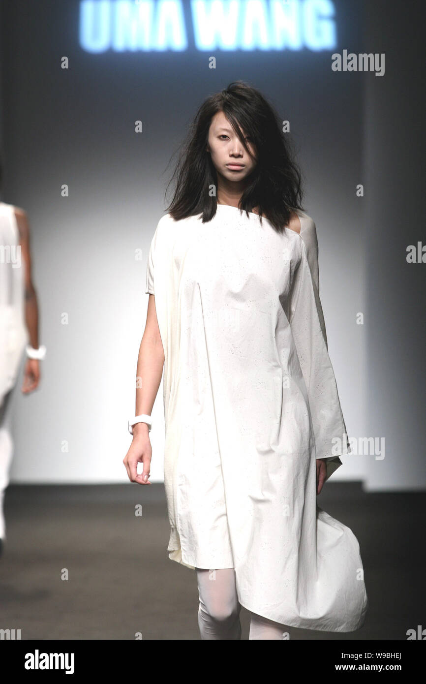 A model parades to show the new collections in the Uma Wang fashion ...