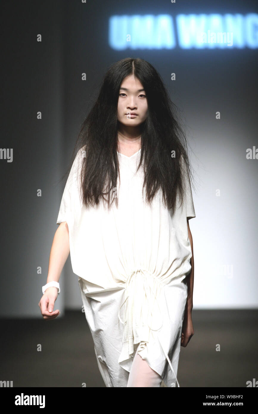 A model parades to show the new collections in the Uma Wang fashion ...