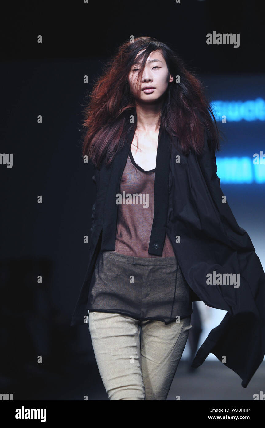 A model parades to show the new collections in the Uma Wang fashion ...