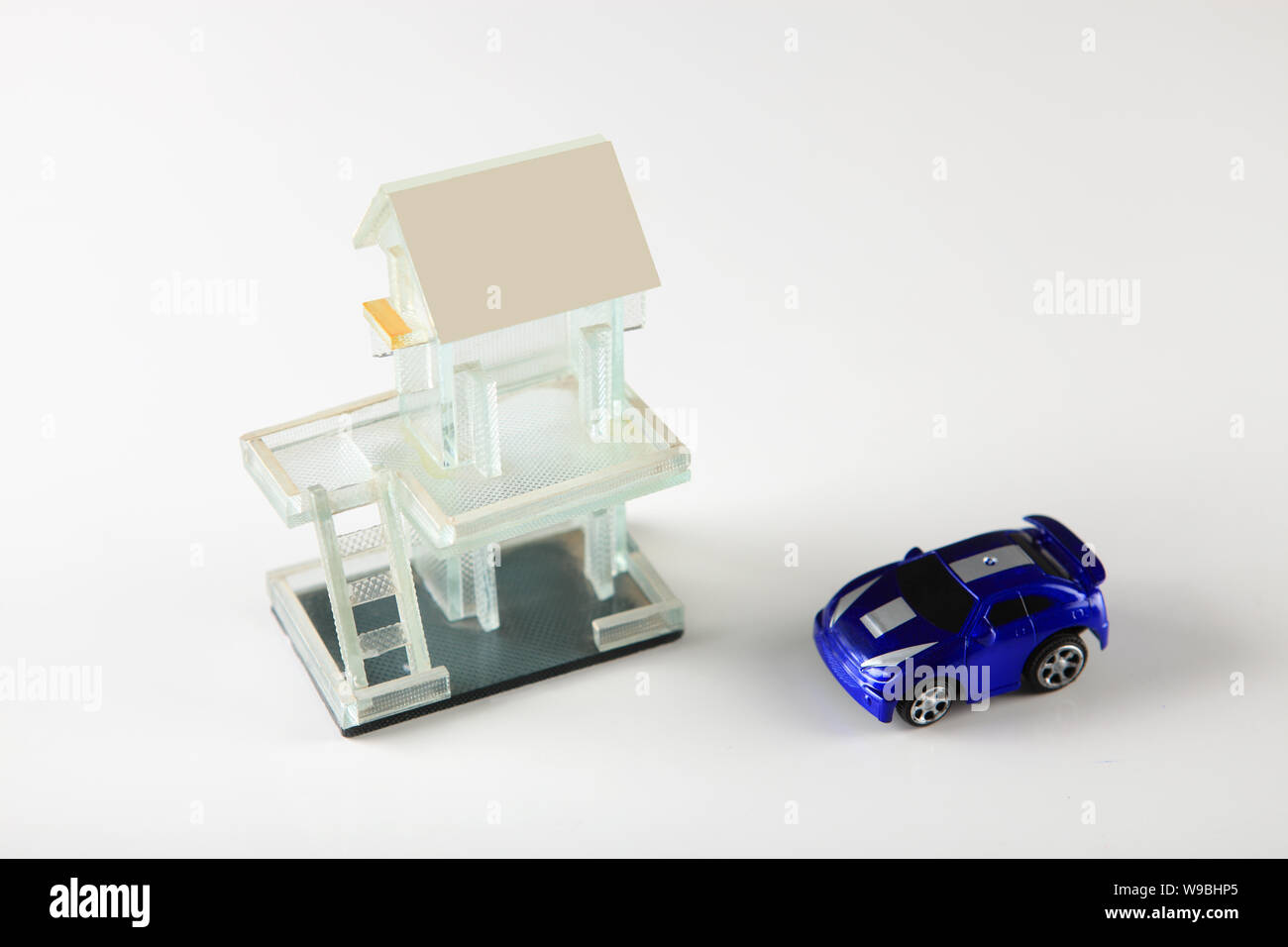 Model home with a toy car Stock Photo - Alamy