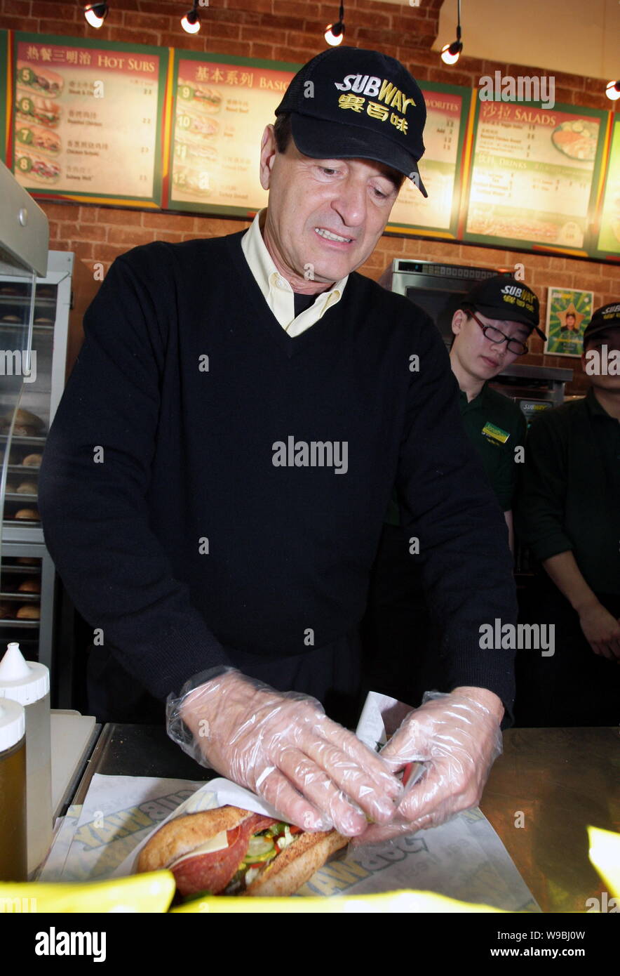 Fred DeLuca, President of Subway, packs a sandwich at a Subway ...