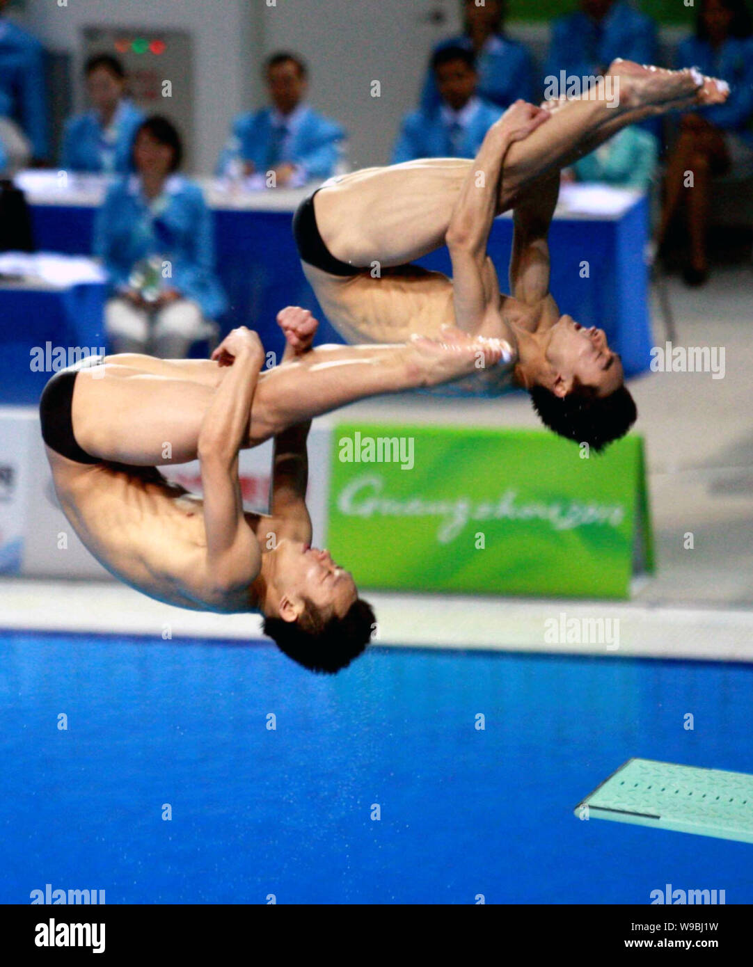 Chinas Luo Yutong and Qin Kai compete in the mens synchronized 3m ...