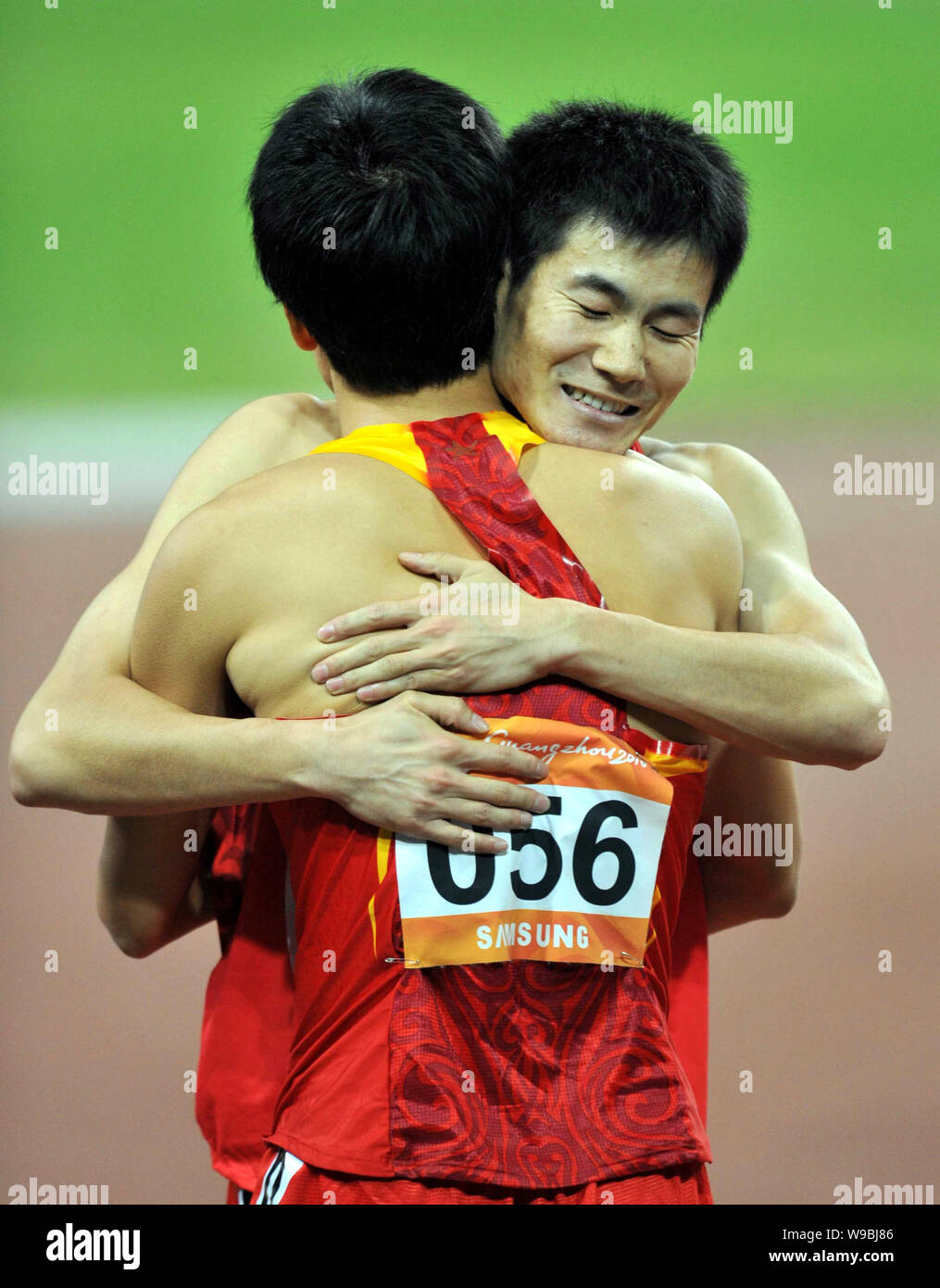 Chinas star hurdler Liu Xiang, front, celebrates with his compatriot ...