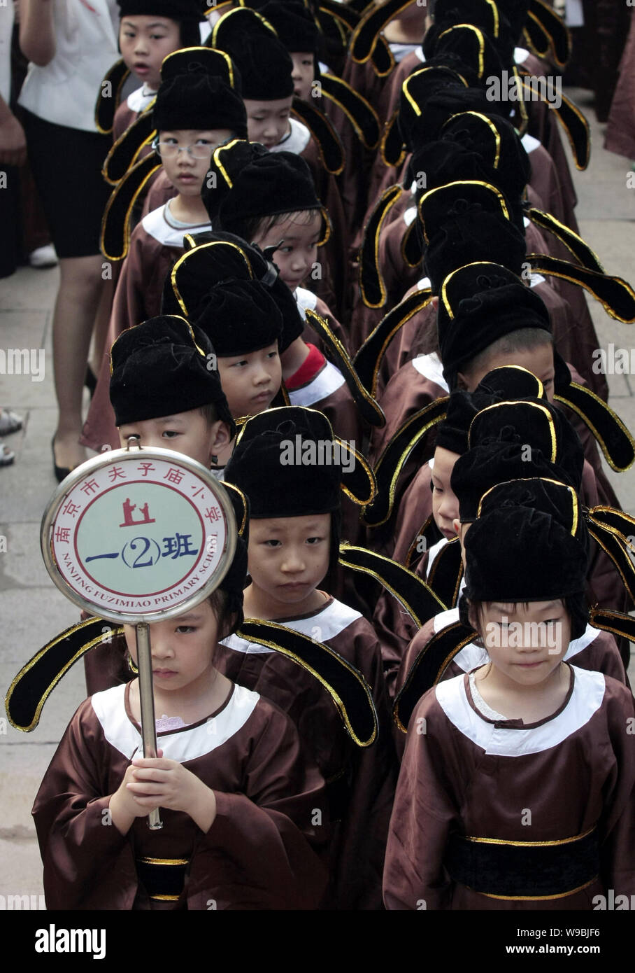 Chinese Grade One pupils wearing traditional Chinese student uniforms ...
