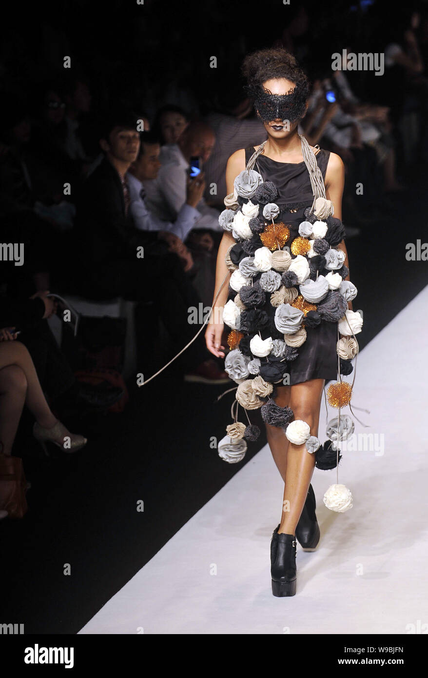 A model parades to show the new collections in the Seven Days fashion ...