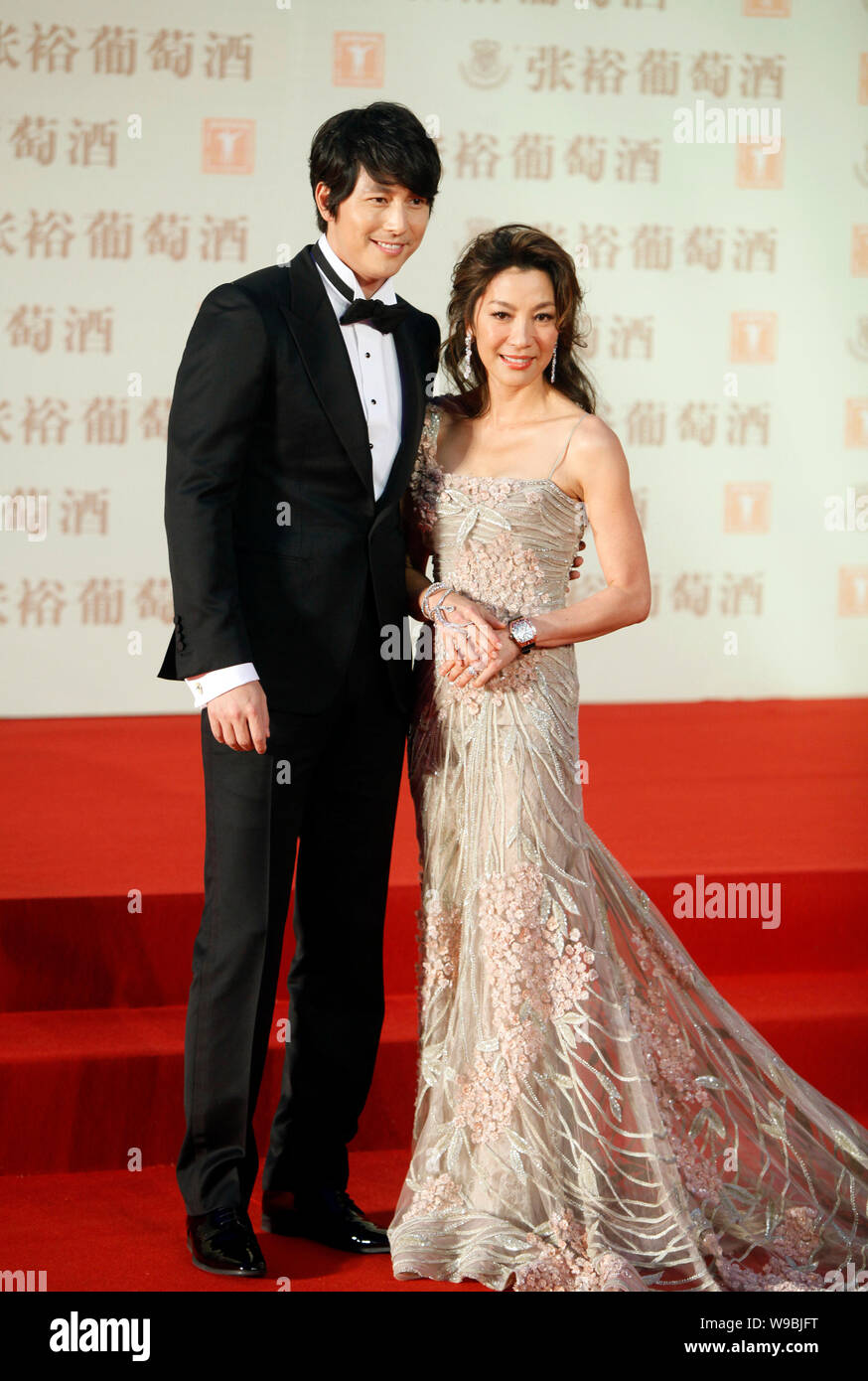 Malaysian actress Michelle Yeoh (R) and South Korean actor Jeong U ...