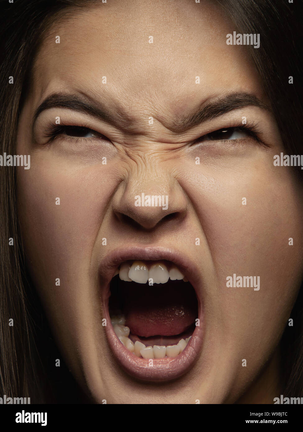 Close up portrait of young and emotional chinese woman. Highly detail ...