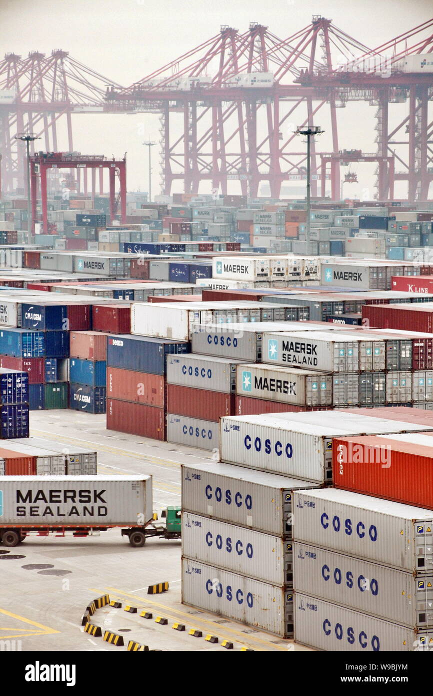 --FILE-- Containers and cranes are seen at the Yangshan Deep Water Port ...