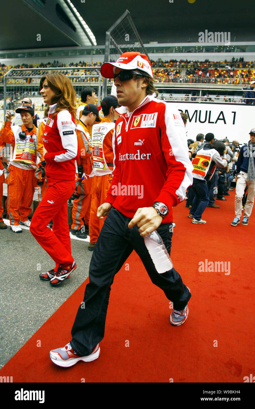 Spanish F1 driver Fernando Alonso of Ferrari, front, arrives for the ...