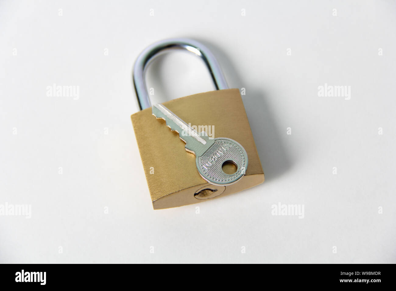 Padlock with key Stock Photo - Alamy
