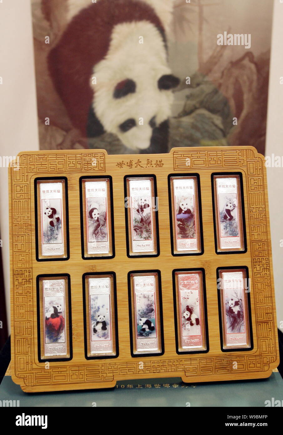 A set of 10 panda-themed silver bars for the World Expo 2010 are seen ...