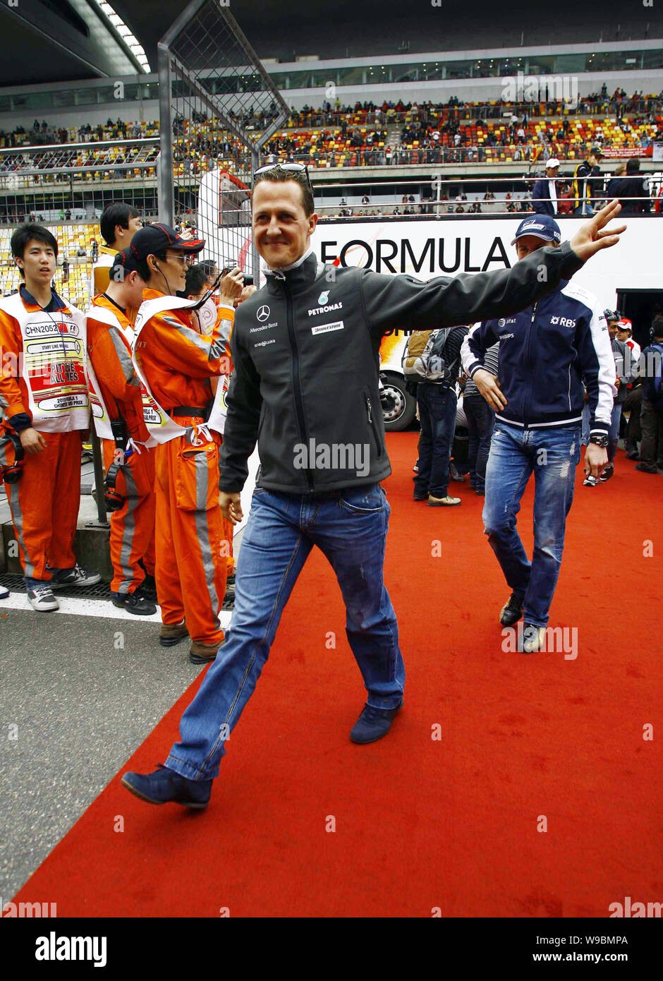 German F1 driver Michael Schumacher of Mercedes GP, front, arrives for ...