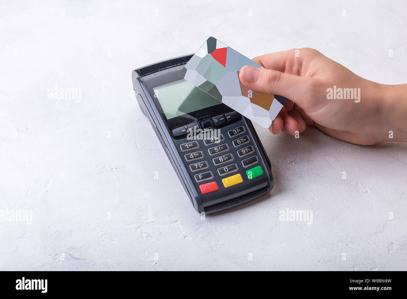 Hand of woman using payment terminal, paying with credit card, credit ...