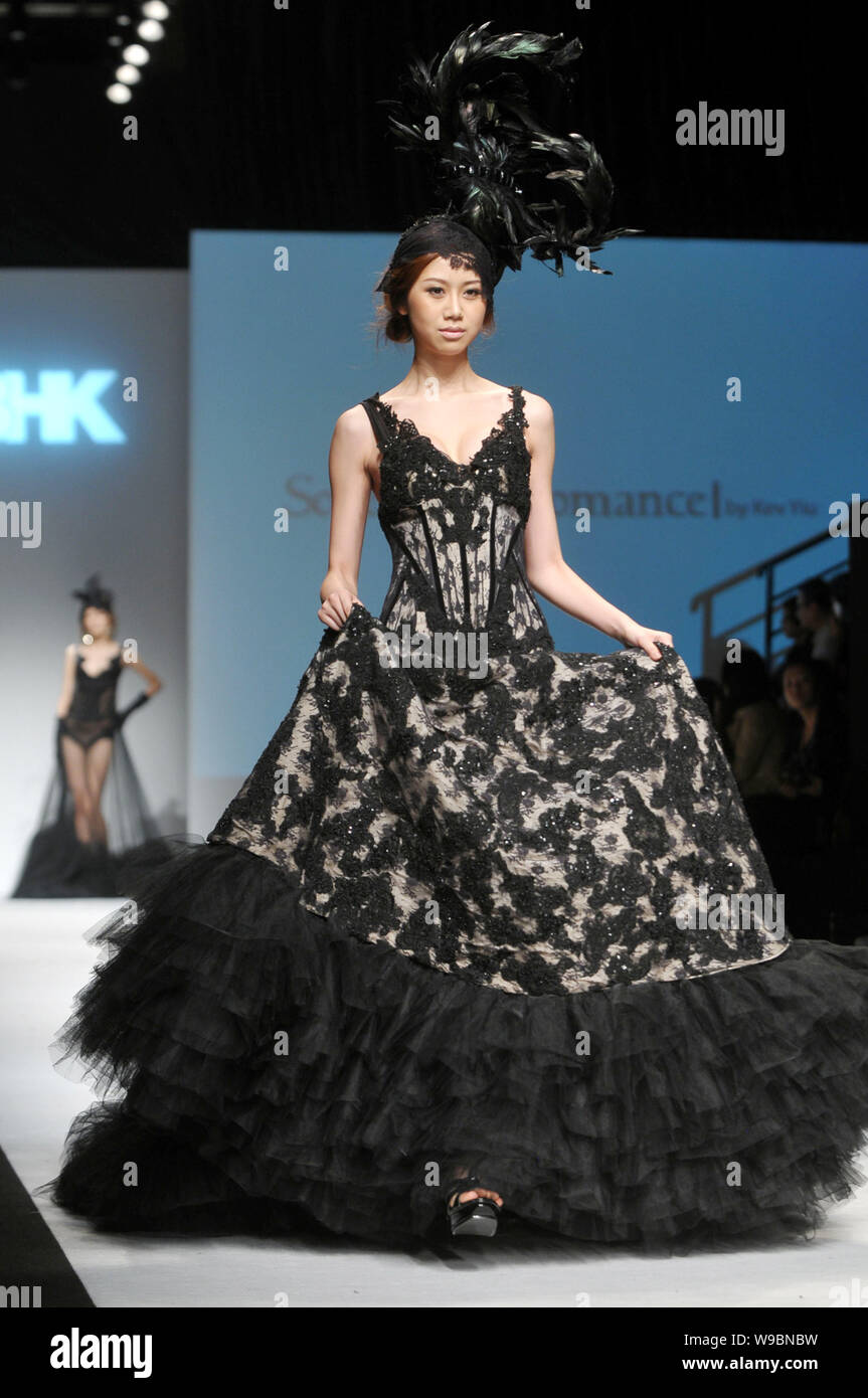 A model parades to show the new collections in the DBHK fashion show ...