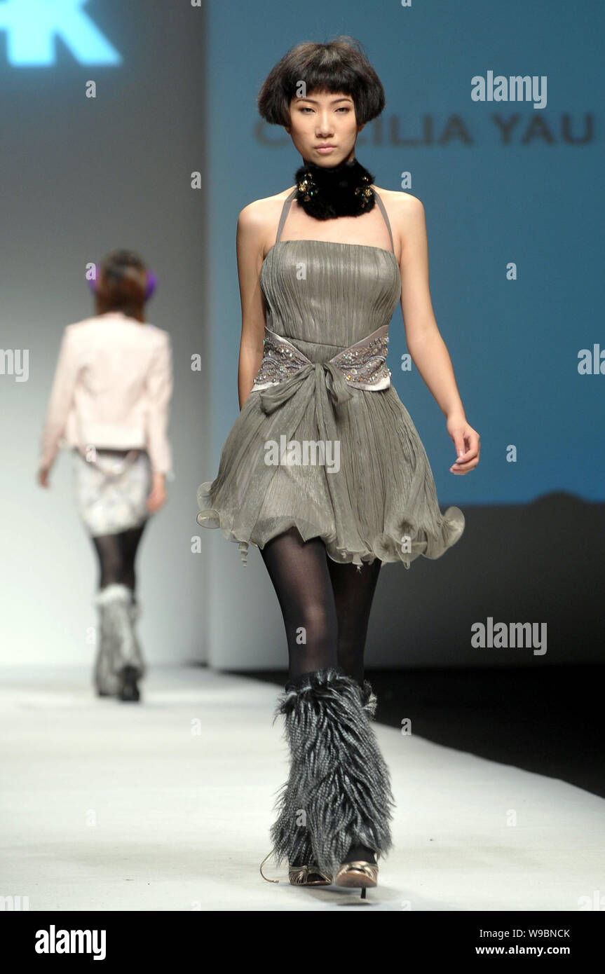 A model parades to show the new collections in the DBHK fashion show ...