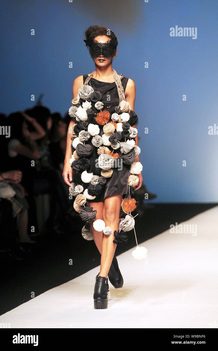 A model parades to show the new collections in the Seven Days fashion ...