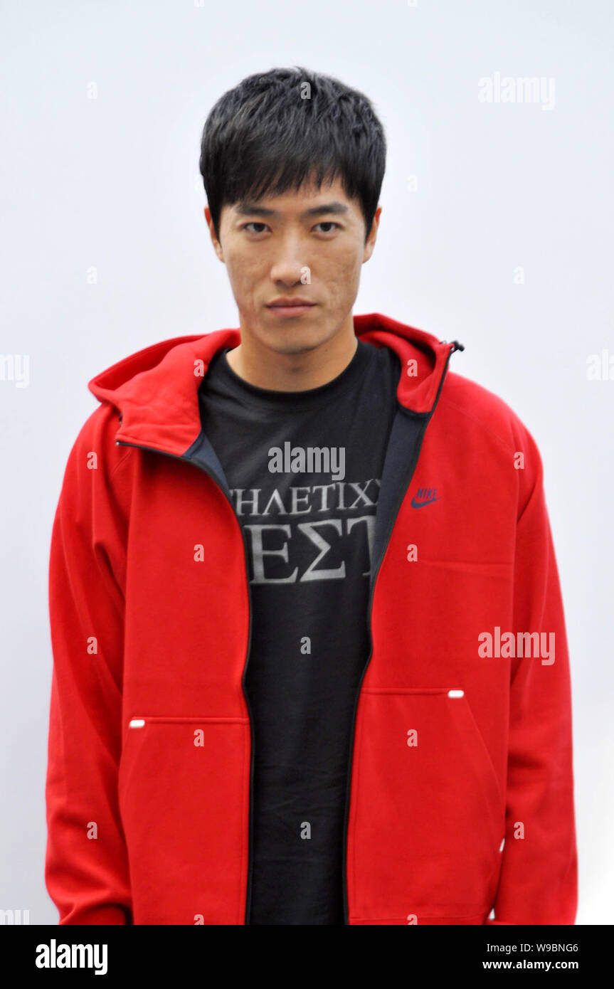Chinese star hurdler Liu Xiang poses during an advertising photo shoot ...