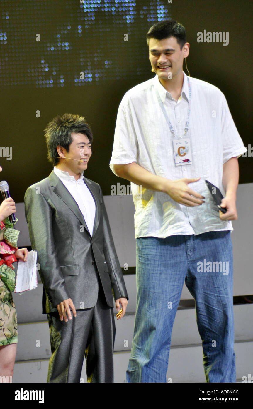 Chinese basketball player Yao Ming of the Houston Rockets, right, and ...