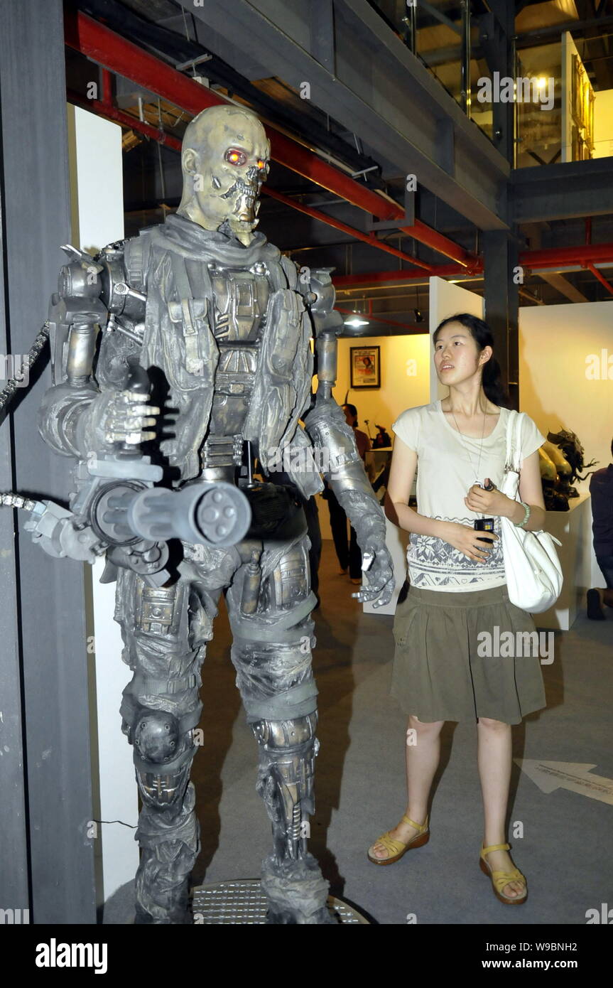 A Chinese visitor looks at a model of the Terminator during the ...