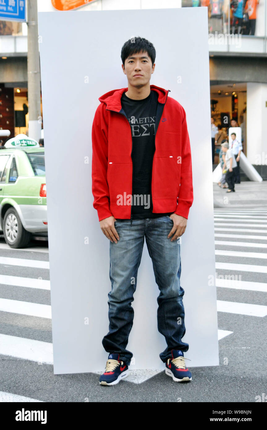Chinese star hurdler Liu Xiang poses during an advertising photo shoot ...