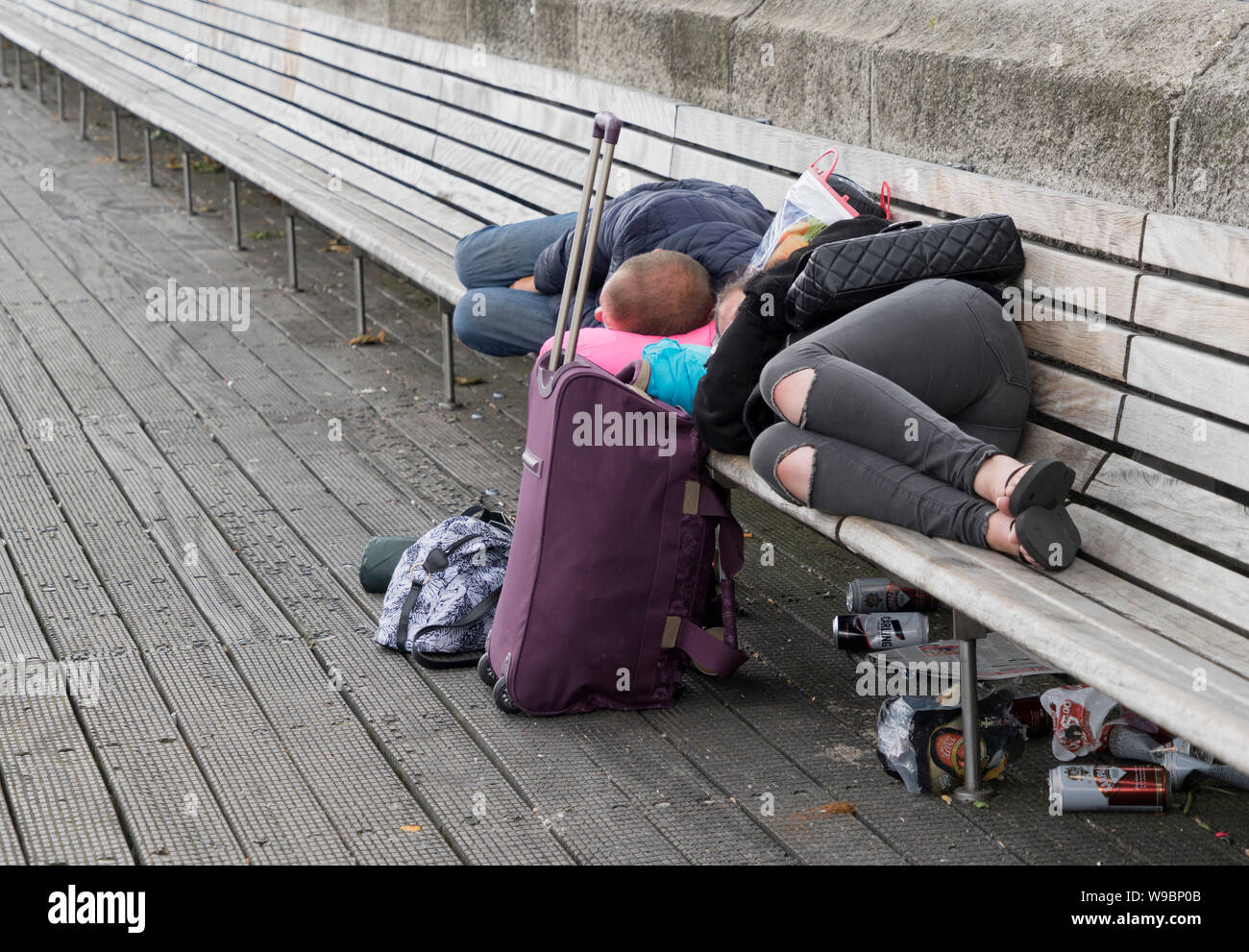 Homeless people sleeping on a bench in a street in Dublin,Republic of ...