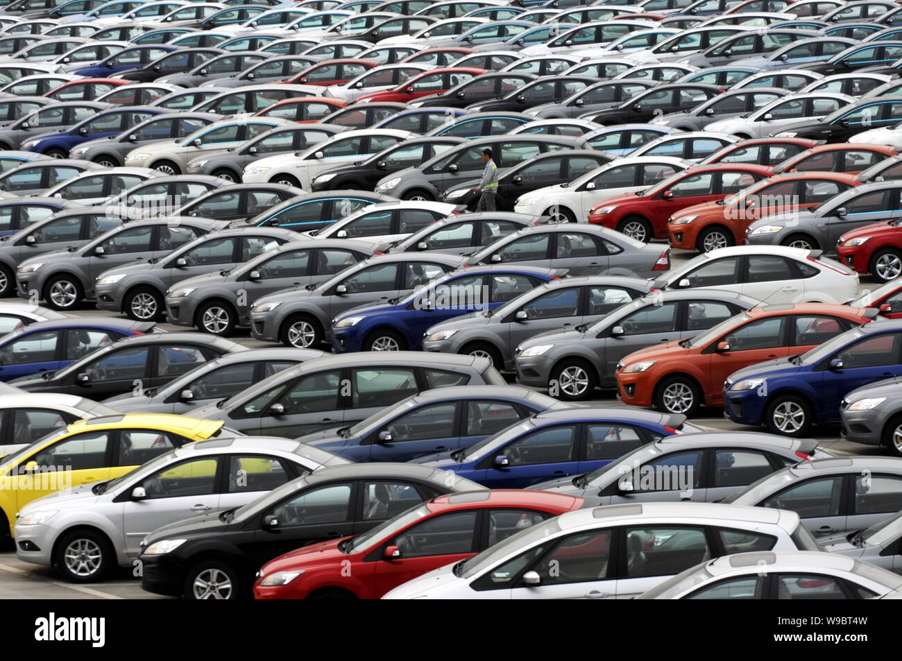 --FILE--Rows of Ford cars, manufactured by the joint venture of Ford ...