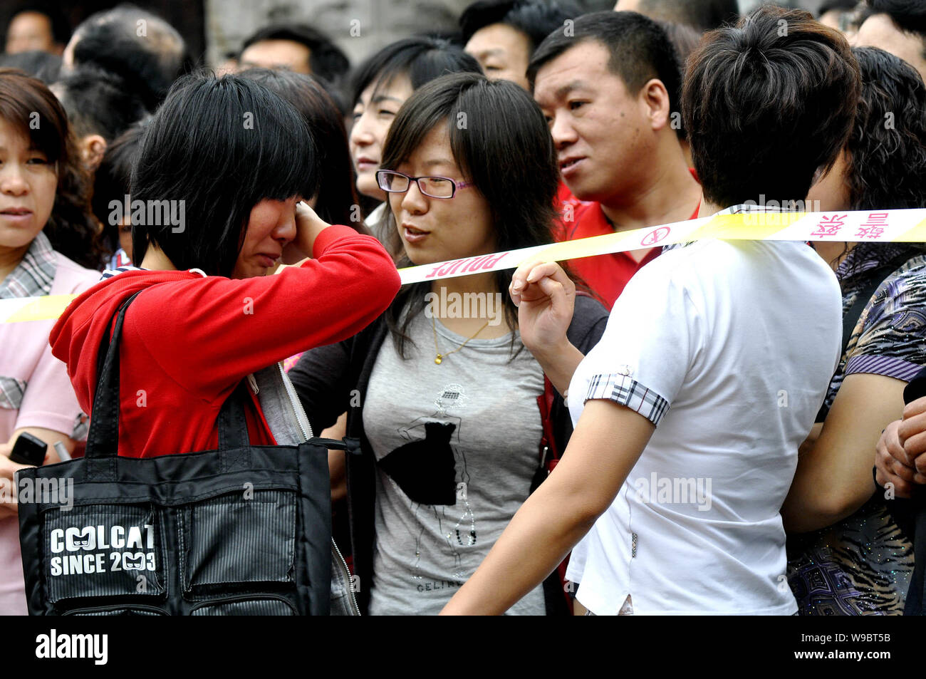 A teacher comforts her crying student before the first test at an exam ...