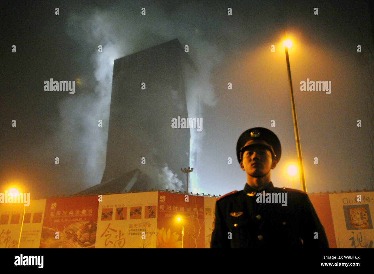 A Chinese paramilitary policeman stands guard in front of the Mandarin ...