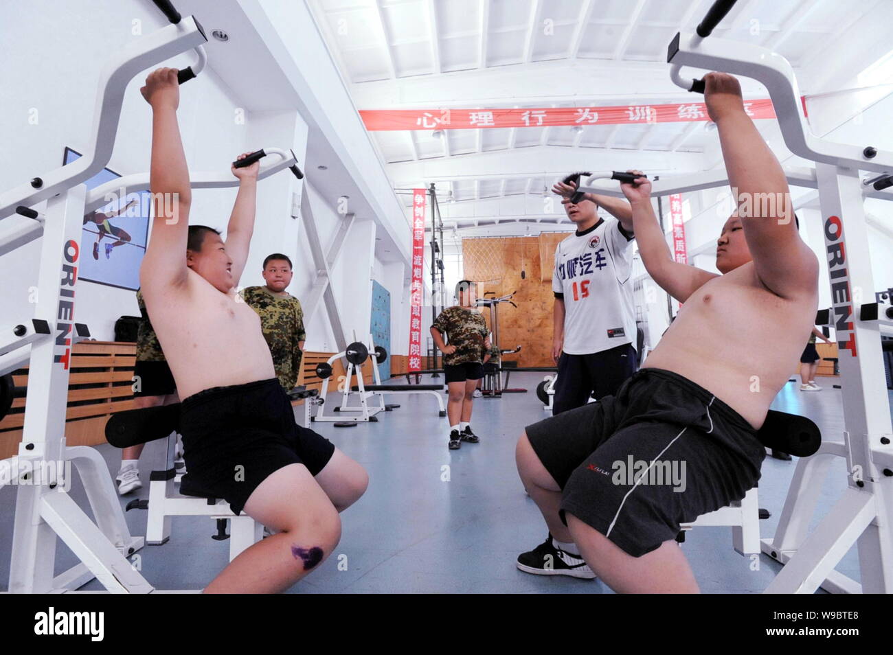Obese Chinese children exercise in a fitness center during a military ...