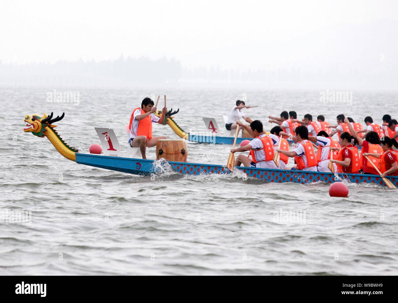 Chinese participants compete during a dragon boat contest celebrating ...