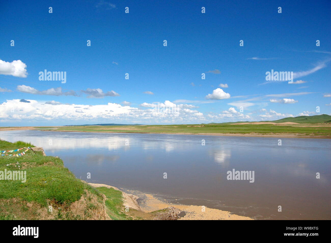 --FILE--The Yellow River water flows past the marshland in Maqu county ...
