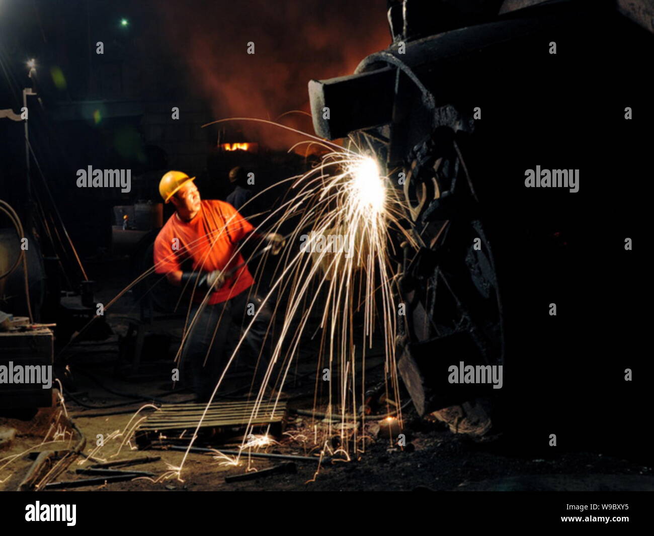 --FILE--A Chinese worker monitors the production of steel at a steel ...
