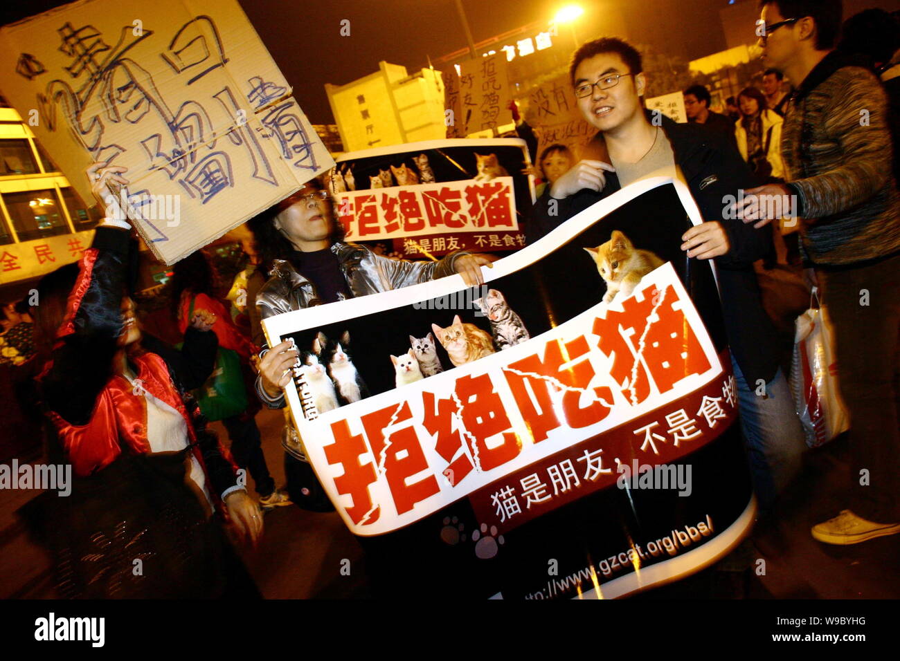 Chinese animal protection activists show slogans during a protest ...