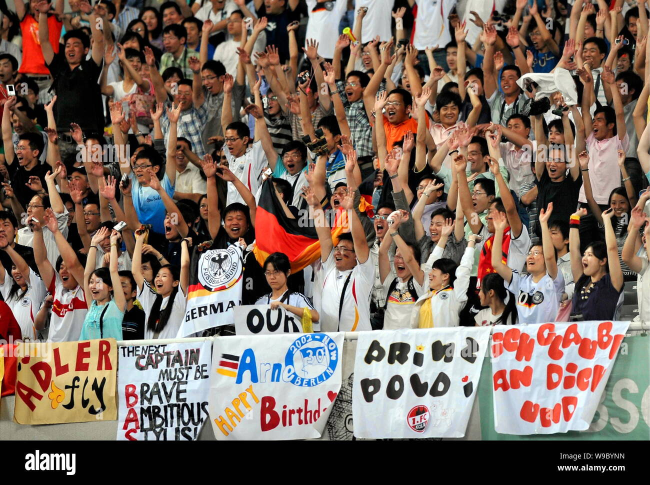 Chinese soccer fans cheer to show support for German national men ...