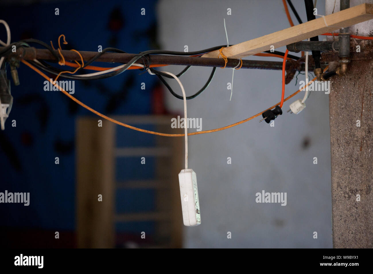 a hodgeplodge of electrical vintage cable hanging down a ceiling Stock ...