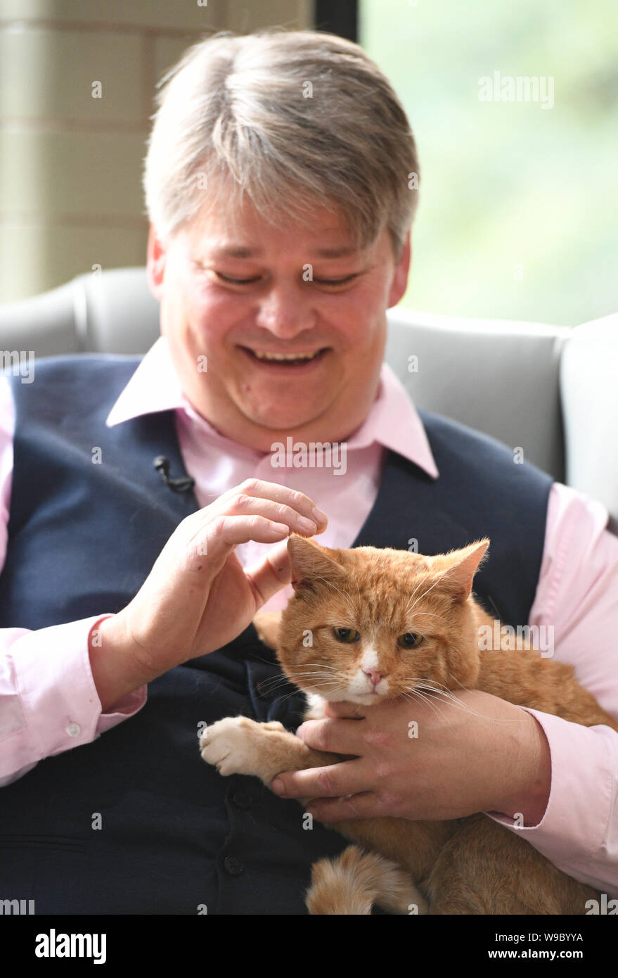 Andrew Hancock from Mansfield, with his cat Shortcake, celebrate at The ...