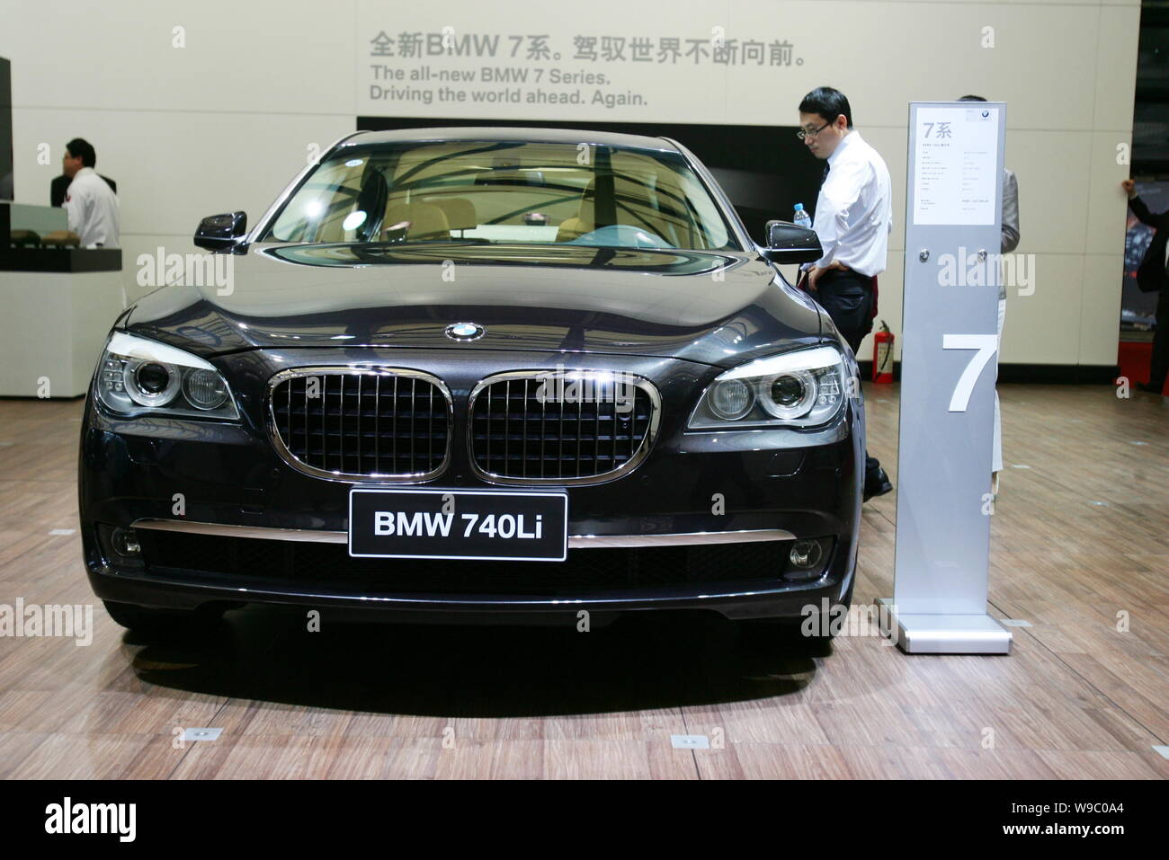 --FILE--Visitors look at a BMW 740Li limousine on display at the 13th ...