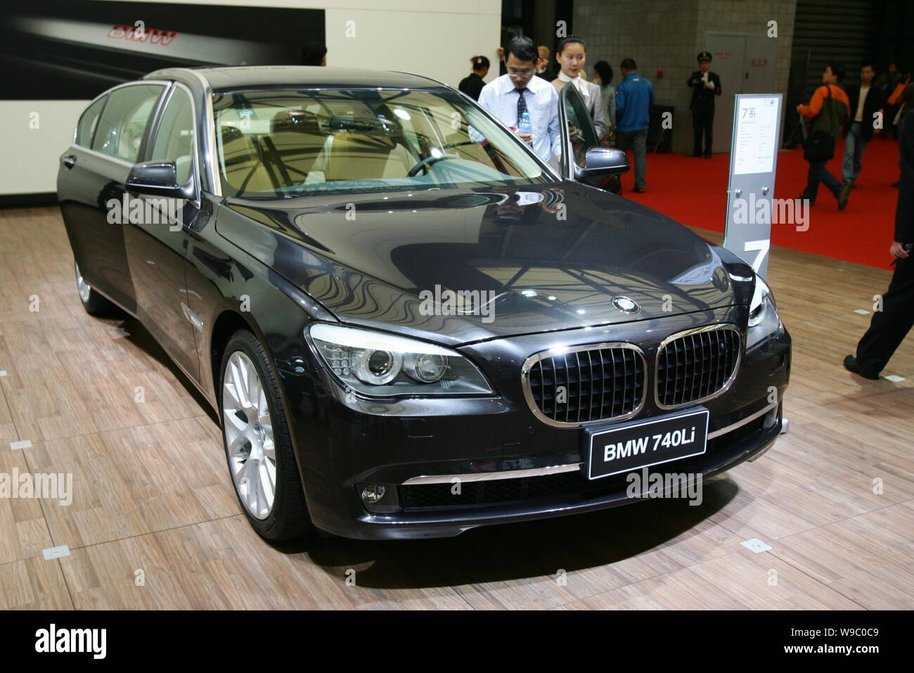 --FILE--Visitors look at a BMW 740Li limousine on display at the 13th ...
