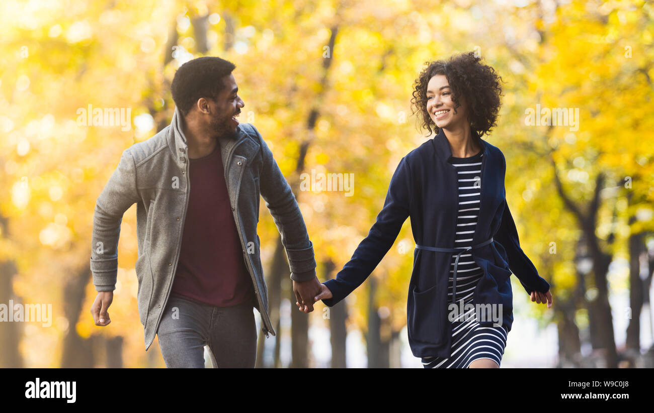 Loving couple having fun in autumn park Stock Photo - Alamy